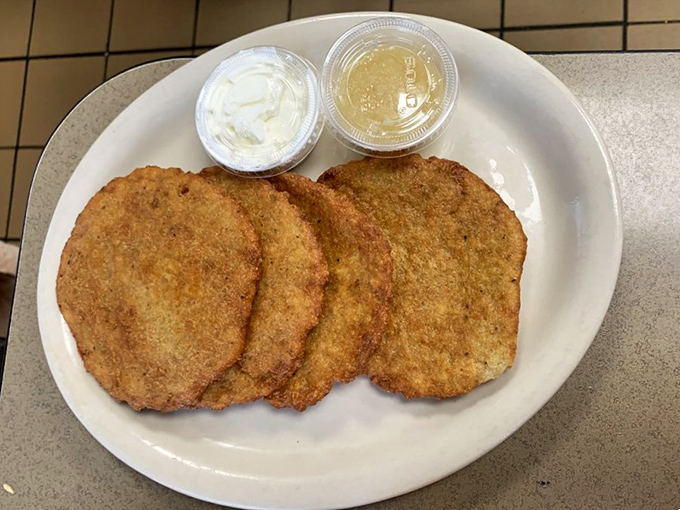 Golden-brown potato pancakes that crackle with each bite, offering the perfect crispy-fluffy ratio that would make any grandmother nod in approval.