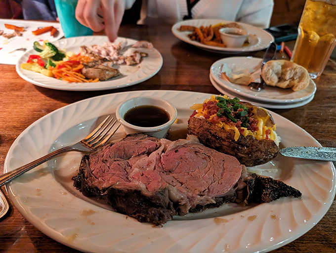 The star of the show takes center stage&mdash;prime rib so beautifully cooked it practically poses for its glamour shot. That loaded potato isn't just a side; it's a co-star.
