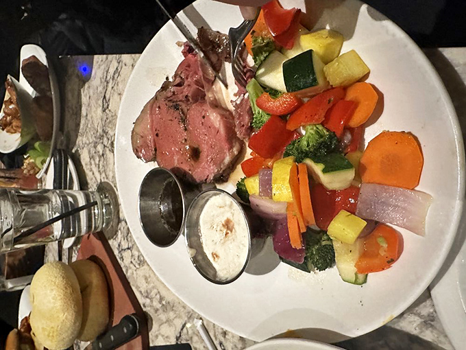 Perfection on a plate: prime rib cooked exactly between "still mooing" and "shoe leather," paired with a rainbow of vibrant vegetables.