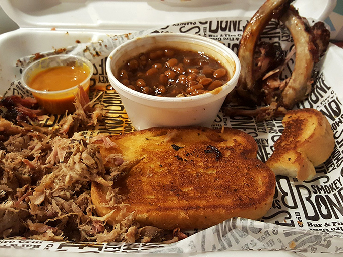 Barbecue in its natural habitat—pulled pork nestled against golden Texas toast with beans that have clearly been simmering since dawn.