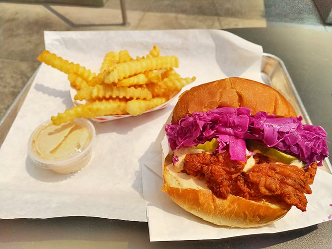 The sandwich that launched a thousand cravings: crispy chicken, vibrant slaw, and those golden crinkle-cut fries. A holy trinity of comfort that speaks directly to your soul.