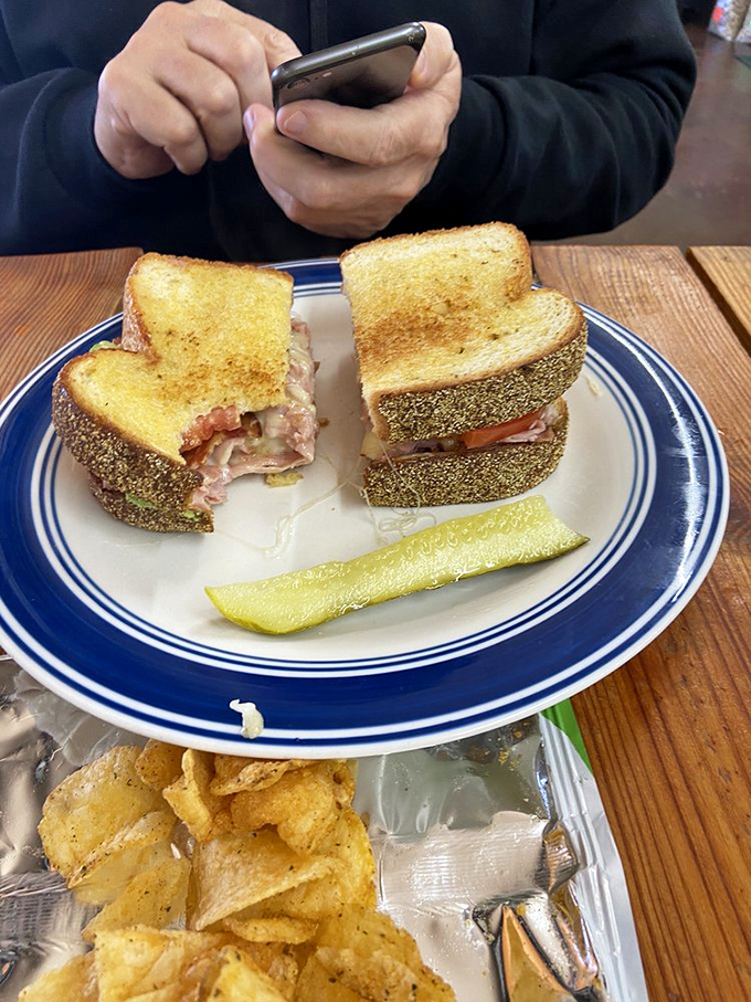 This sandwich isn't just taking a photo &ndash; it's posing for its James Beard award. Perfectly grilled bread with secrets hiding inside.