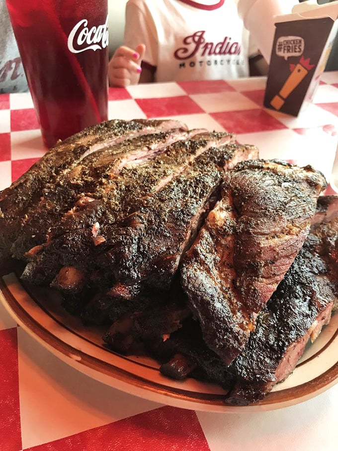 These ribs have the kind of smoke ring that makes pitmasters weep with joy. That beautiful crust is what happens when patience meets fire.