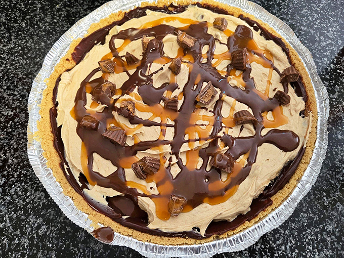 The dessert equivalent of winning the lottery. Peanut butter, chocolate, caramel, and Reese's cups united in a pie that makes grown adults negotiate for the last slice.