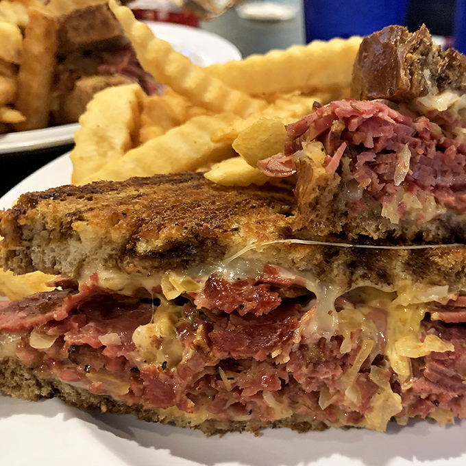 The money shot&mdash;where melted Swiss cascades over perfectly pink corned beef, creating the kind of sandwich that ruins all other lunches for you.