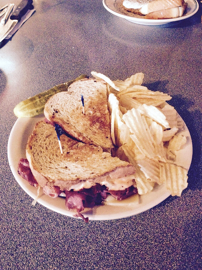 This isn't just a sandwich; it's architecture. The structural integrity of that perfectly grilled rye somehow containing a small mountain of corned beef deserves an engineering award.