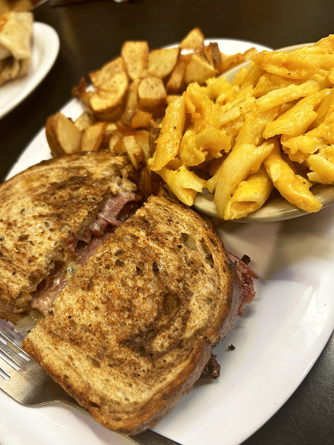 A proper Reuben should require both hands and several napkins. This one delivers on that sacred deli promise.