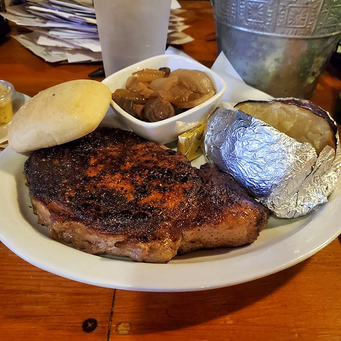 This is not just a steak, it's a declaration of love&mdash;with a perfectly seared crust, a baked potato, and mushrooms that have found their true purpose.
