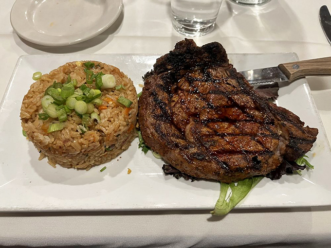 This ribeye isn't just a steak; it's a declaration of independence from mediocre meals, served with rice that's clearly paying attention.