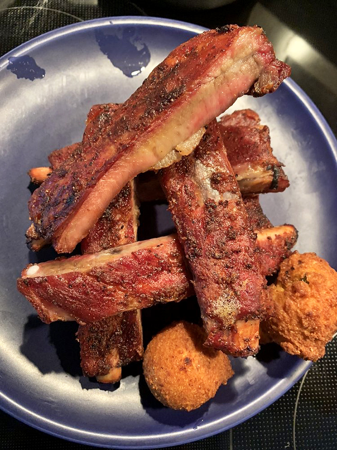 These ribs have the kind of bark that commands attention. The meat's not falling off the bone&mdash;it's holding on just enough to maintain its dignity.