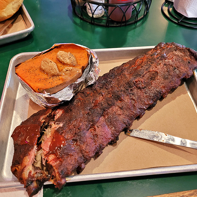 These ribs aren't just fall-off-the-bone tender; they practically leap onto your fork! A carnivore's delight that'll have you questioning your table manners.