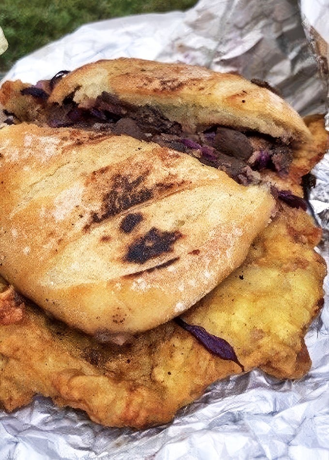 This sandwich doesn't need a passport to transport you. Grilled bread embraces mysterious fillings with the confidence of something truly extraordinary.