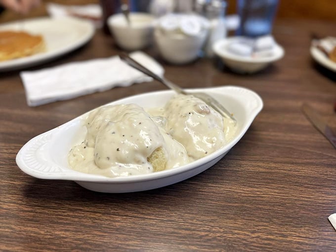 These biscuits and gravy aren't just breakfast&mdash;they're an edible hug from the South, smothered in creamy, peppery goodness that grandmothers everywhere would approve of.