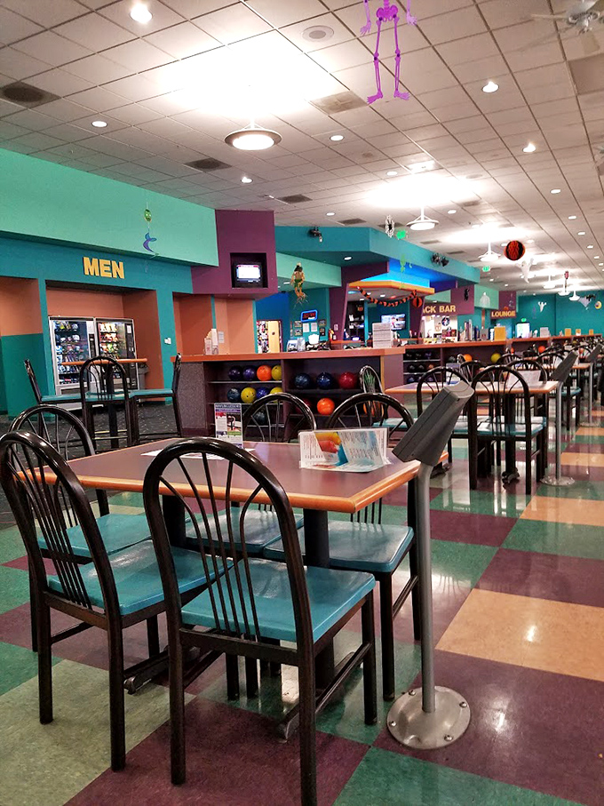 The dining area's colorful floor tiles and teal accents scream "1990s revival," but somehow it feels exactly right for post-strike celebrations.