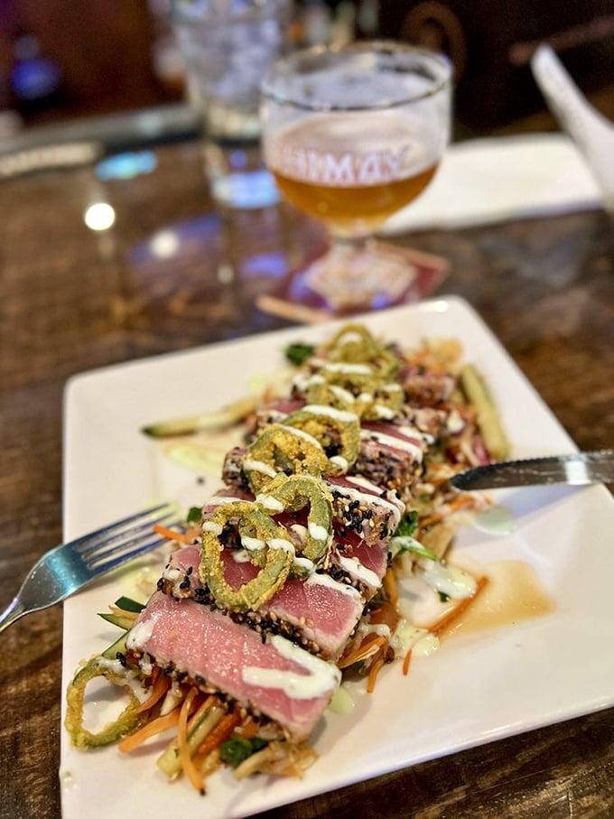 Sesame-crusted tuna, seared just long enough to say hello to the heat. The pink center whispers, "We respect good fish here."