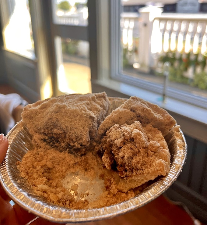 The perfect cross-section reveals shoofly pie's signature layers&mdash;crumbly top and gooey molasses bottom that's been tempting travelers for generations.
