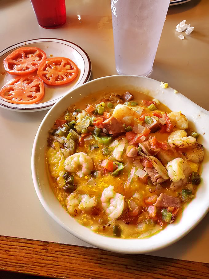 This shrimp and grits masterpiece isn't just breakfast, it's the South Carolina coast giving you a warm, cheesy good morning hug.