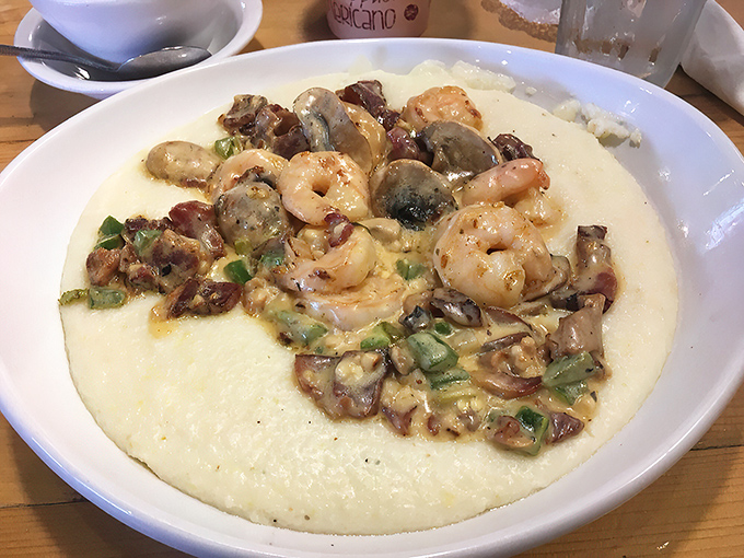 The legendary shrimp and grits in all their glory. Those plump shrimp aren't just swimming&mdash;they're doing the backstroke in flavor country.