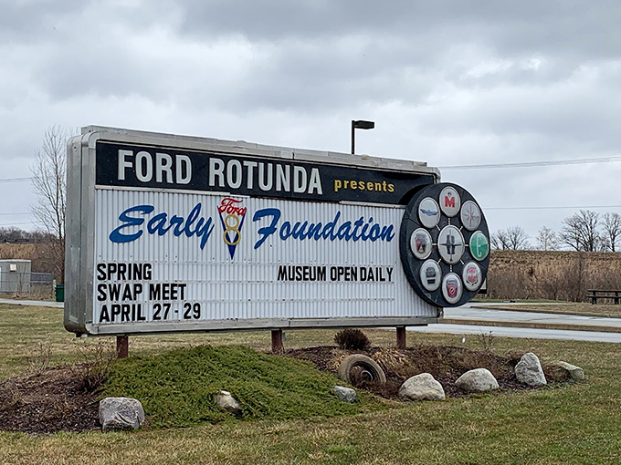 The museum's roadside sign proudly announces its presence with vintage flair, promising automotive treasures inside. Even the signage has classic appeal.