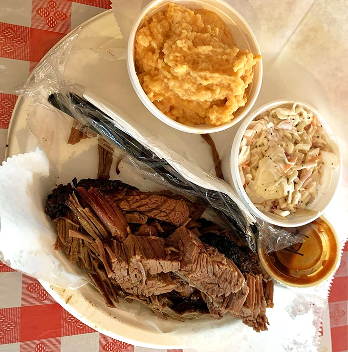 Brisket so perfectly sliced it belongs in a museum. The sides aren't afterthoughts&mdash;they're worthy companions on this smoky journey.