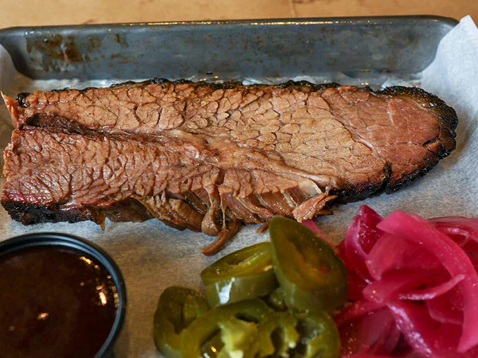 Smoke ring perfection&mdash;this brisket slice displays that coveted pink halo that whispers, "I've been pampered in smoke for hours just for you."