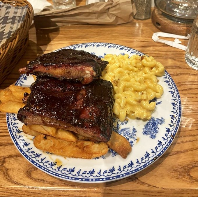 These ribs don't just fall off the bone&mdash;they practically leap into your mouth. Paired with mac and cheese that's practically glowing with Southern hospitality.