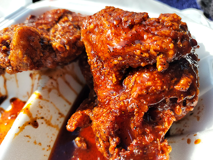 That glorious red sauce glistens with promises it fully intends to keep. Not too hot, not too sweet&mdash;just the perfect chicken commitment.