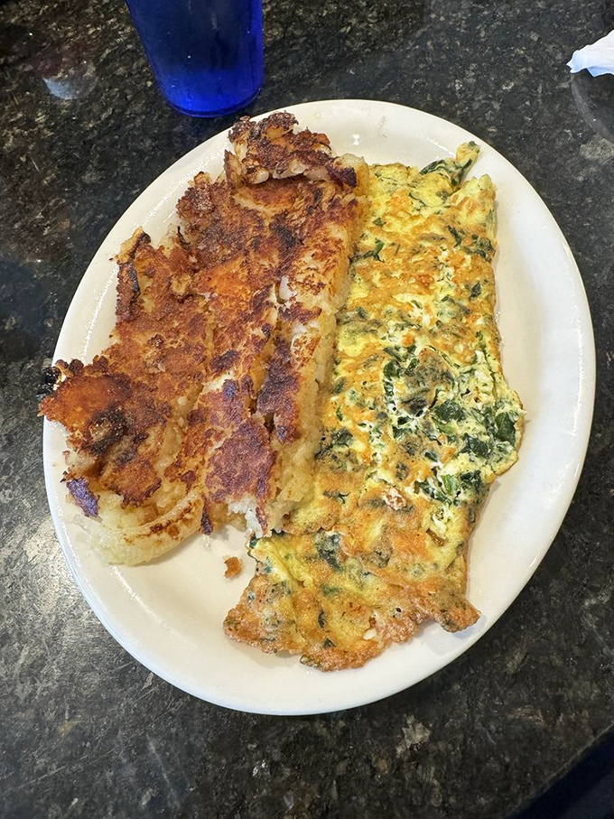 This isn't just an omelet&mdash;it's architecture. A masterclass in the art of egg-folding with spinach and feta playing supporting roles.