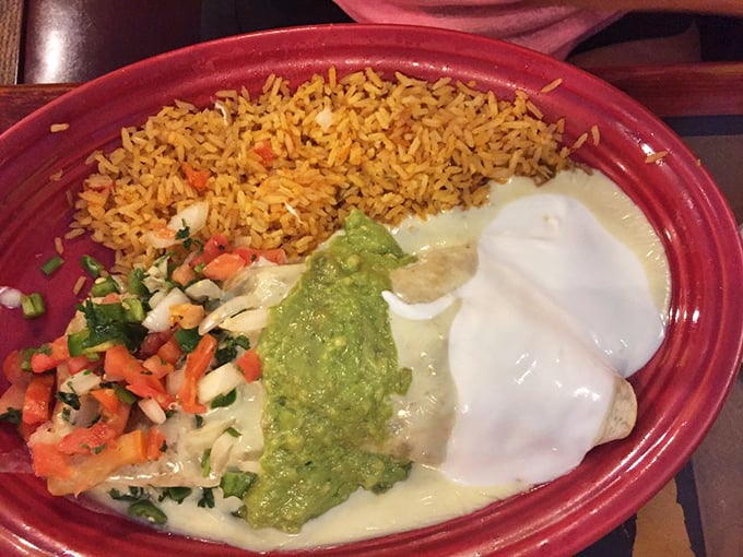 This isn't just a meal, it's an event. The rice, guacamole, and cheese-blanketed burrito form the holy trinity of comfort food.
