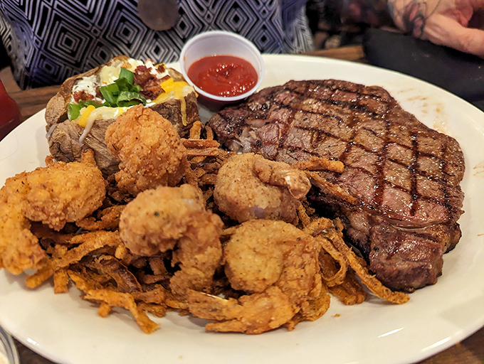 This plate has everything: a glorious steak, loaded potato, and fried shrimp. It's not a meal&mdash;it's a celebration.