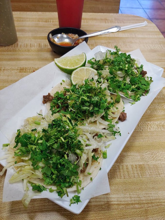 These steak tacos come dressed for success with fresh cilantro and onion. The lime wedges aren't just garnish&mdash;they're essential supporting actors.