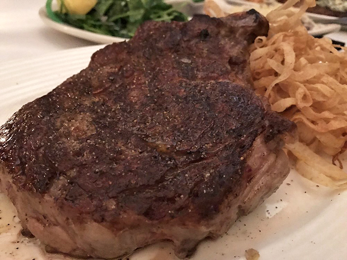 A perfectly seared steak with that caramelized crust that makes grown adults close their eyes and sigh with contentment.