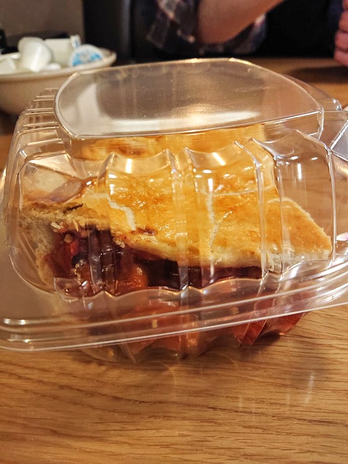 The perfect slice to go—this strawberry rhubarb treasure in its clear container is like carrying edible happiness. Worth every sticky finger.