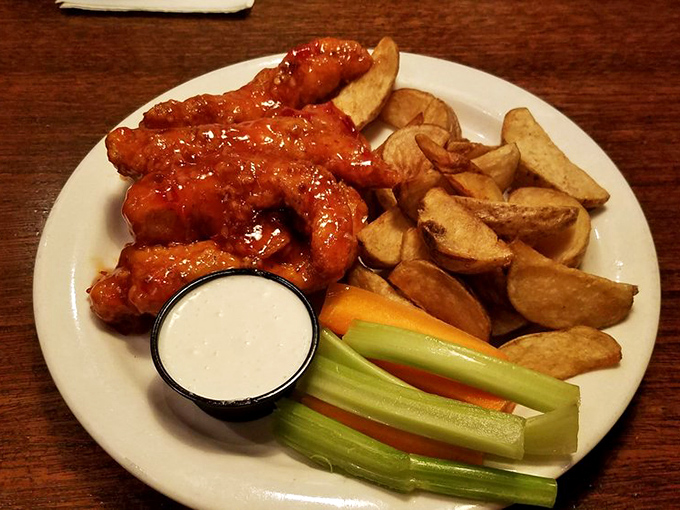 These Buffalo Tenders deserve a national holiday &ndash; crispy, saucy, and served with cooling ranch and potato wedges that George Washington would've crossed the Delaware for.