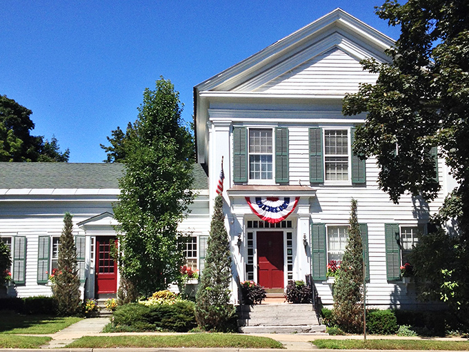 The White House Inn: This classic American home, draped in patriotic bunting, looks like it's waiting for Norman Rockwell to set up his easel. 