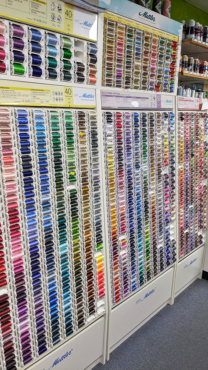 The thread wall—where indecision reaches Olympic levels as crafters debate whether "seafoam" or "mint" best matches their project.