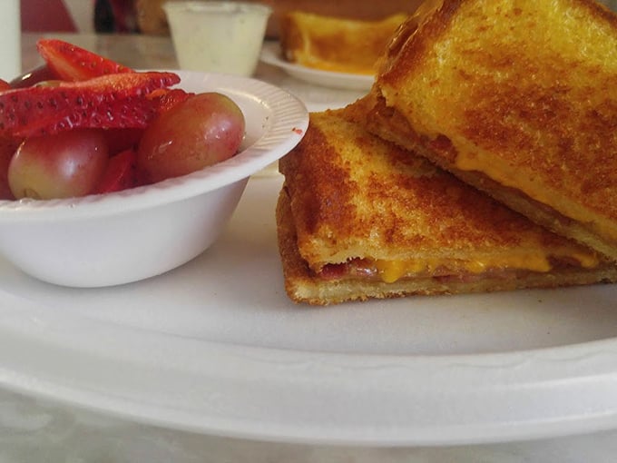 The grilled cheese that time forgot&mdash;perfectly golden, defiantly simple, and surrounded by fruit that makes you feel slightly virtuous.