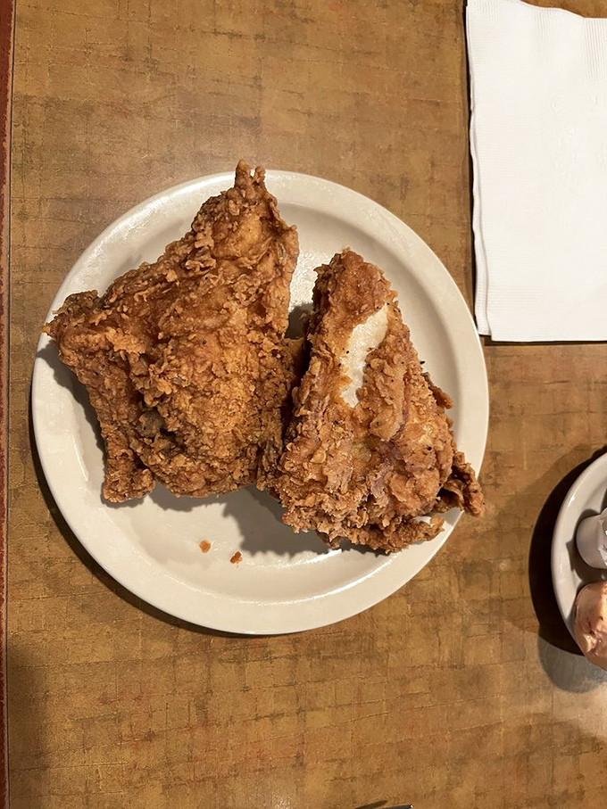 Fried chicken so perfectly golden it should come with its own trophy. That crackling crust is the percussion section in a symphony of flavor.