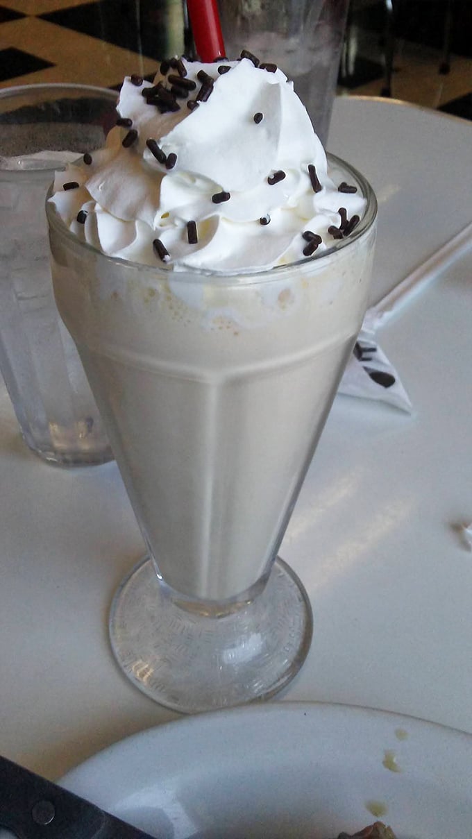 This vanilla milkshake isn't just thick&mdash;it's the kind that makes your straw stand at attention while chocolate sprinkles add just enough rebellion. 