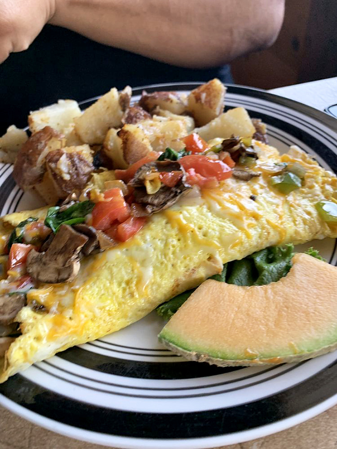 The vegetarian omelet proves that meatless can be magnificent&mdash;a garden of vegetables nestled in perfectly cooked eggs alongside golden homefries.