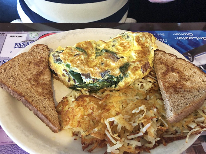 Some vegetable omelets look apologetic for lacking meat. This robust creation, nestled among crispy hash browns, clearly didn't get that memo.