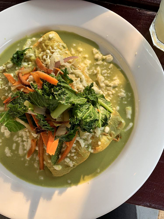 These enchiladas aren't drowning in cheese&mdash;they're celebrating with it. The fresh vegetables on top aren't garnish; they're co-stars in this delicious production.