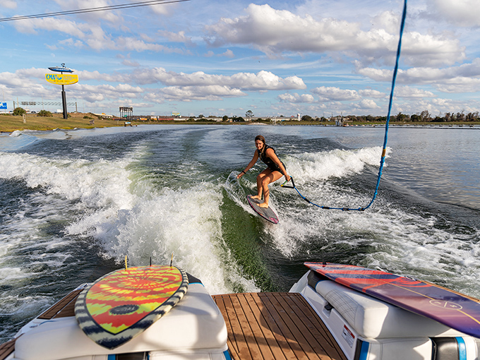 Wakeboarding at OWC isn't just a sport—it's flying across water with style. The cable system eliminates boats but keeps all the thrills.