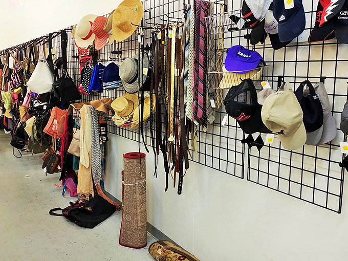 The accessories wall&mdash;where belts, hats, and scarves create a textile tapestry of fashion history waiting to be unraveled.