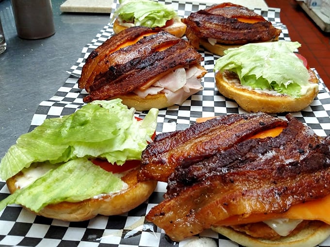 Bacon on burgers isn't just a topping here&mdash;it's architectural support for what can only be described as meat skyscrapers.