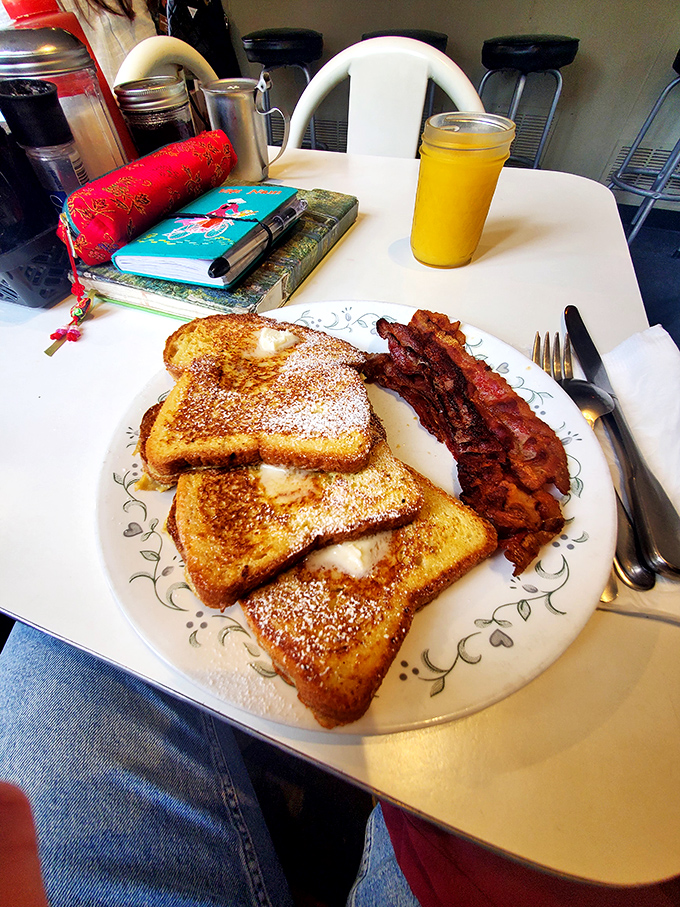 French toast that doesn't just whisper but announces itself with powdered sugar confetti. The kind of breakfast that makes you wonder why we don't eat dessert first every day.