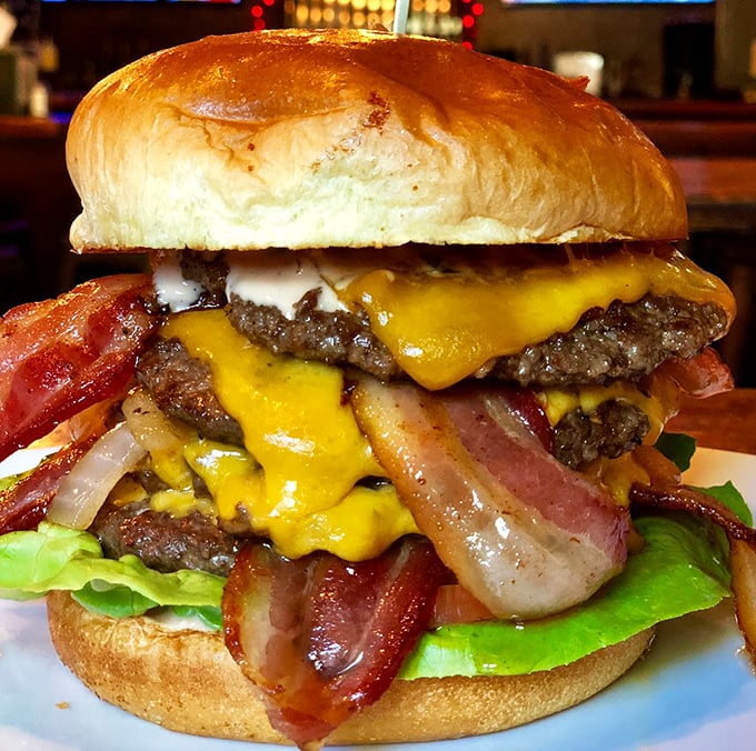 This towering bacon cheeseburger doesn't just satisfy hunger&mdash;it obliterates it. The architectural marvel that would make Frank Lloyd Wright weep with delight.
