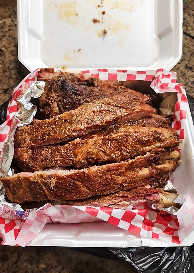 Ribs that make you question every other rib you've ever eaten. That glistening, bark-crusted exterior is nature's way of saying "good things come to those who wait."