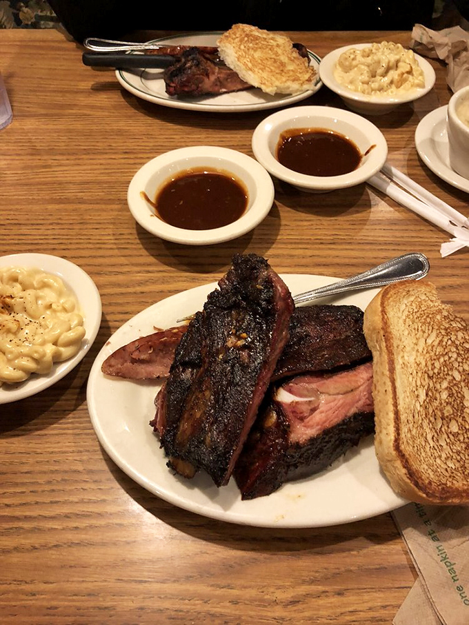 The barbecue sandwich that launched a thousand road trips. That golden bun cradles smoky meat like it's holding the Hope Diamond.