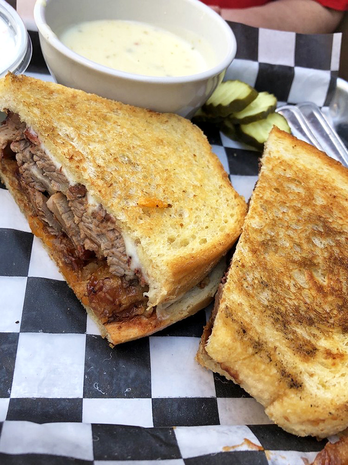 This brisket melt isn't just a sandwich&mdash;it's architecture. Layers of smoky beef between golden bread with a side of comfort that tastes like childhood, but better.